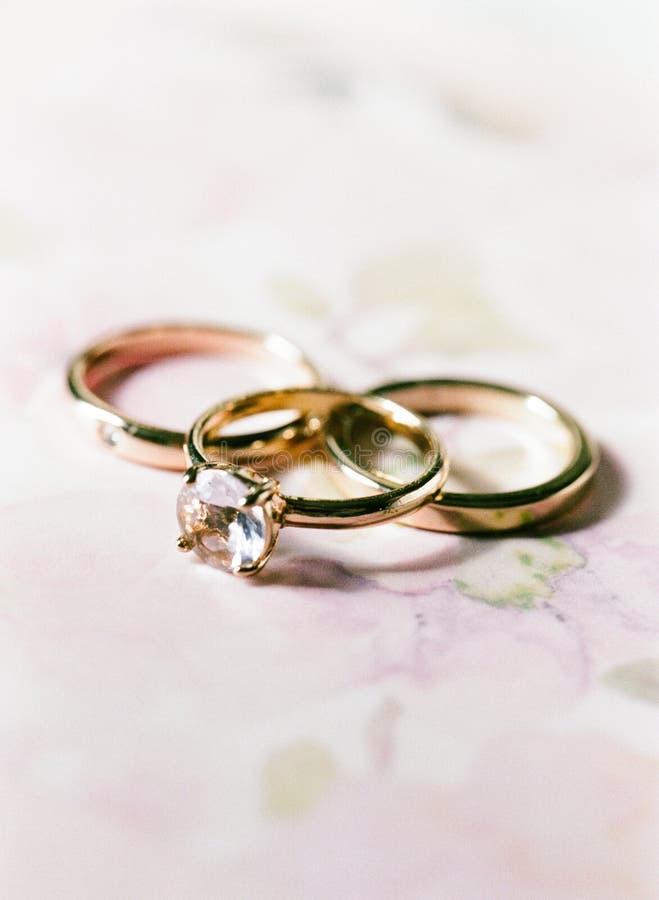 Elegant Gold Rings Featuring a Sparkling Gemstone Arranged Beautifully ...