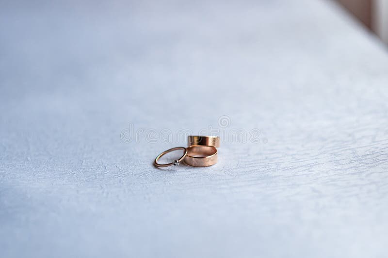 Elegant Close-Up of Wedding Rings on Textured Surface Stock Photo ...