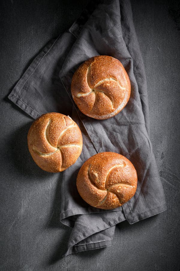 Three Golden Buns on Grey Linen Napkin Stock Image - Image of food ...