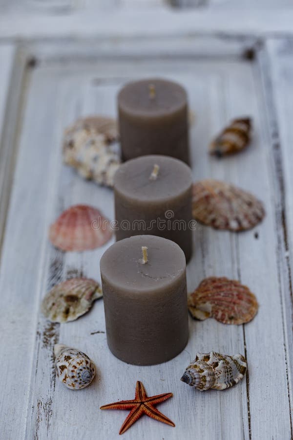 Three Gray Candles with Seashells Stock Photo - Image of ocean, east ...