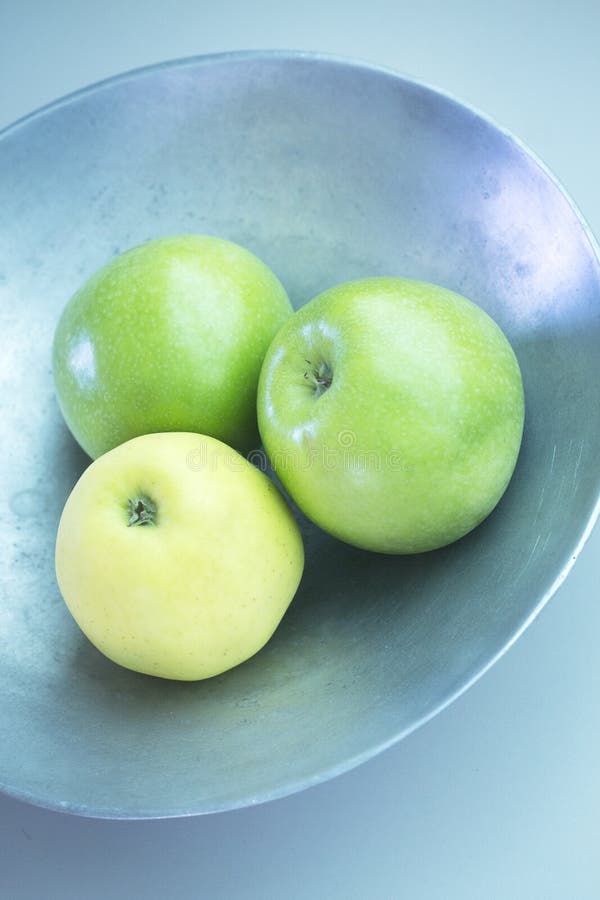 Three green apples on dish stock image. Image of organic - 78424977