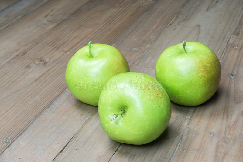 Three green apples stock image. Image of grainy, color - 74021569