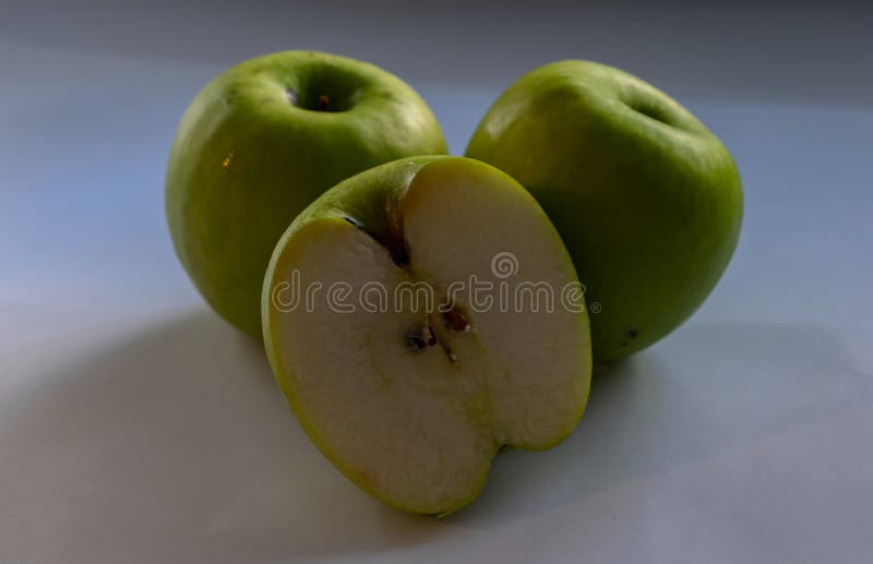 Three Green Apples on a White Surface Stock Photo - Image of organic ...