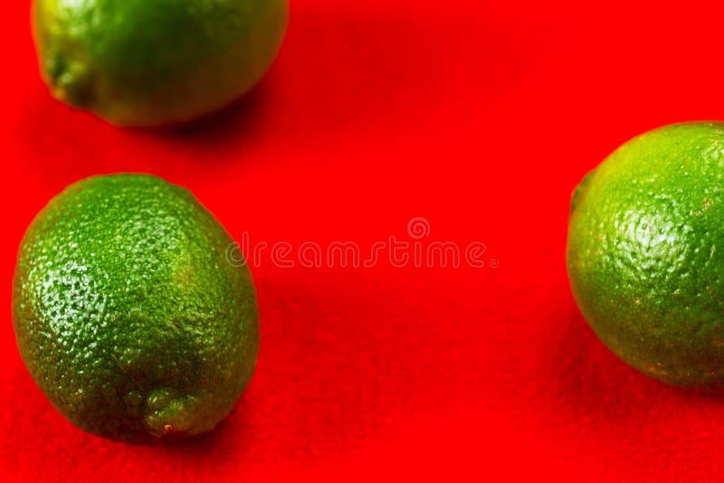 Three Green Lime on Red Background Stock Image - Image of pattern ...