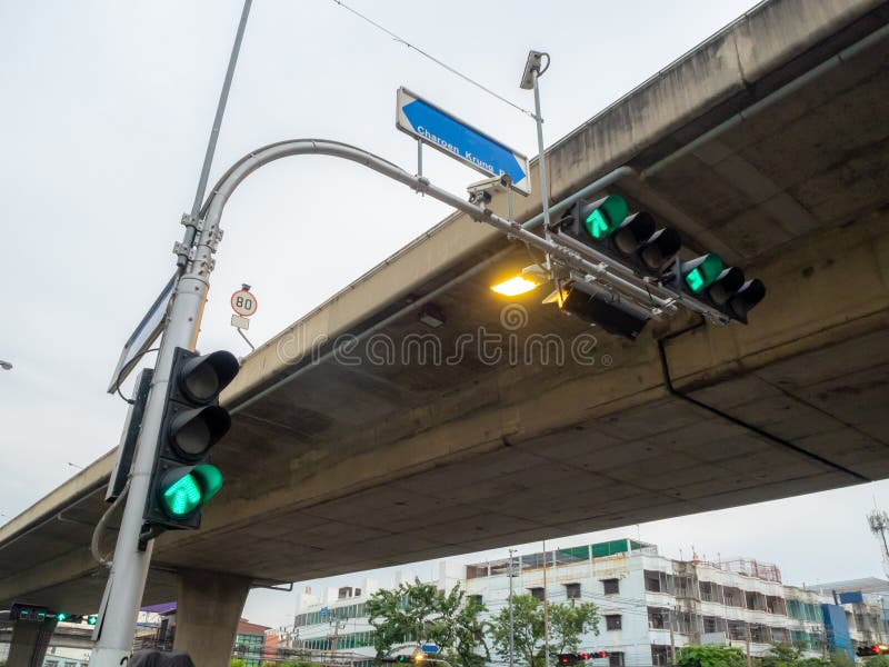 Three Green Traffic Light at Intersection in the City Stock Photo ...