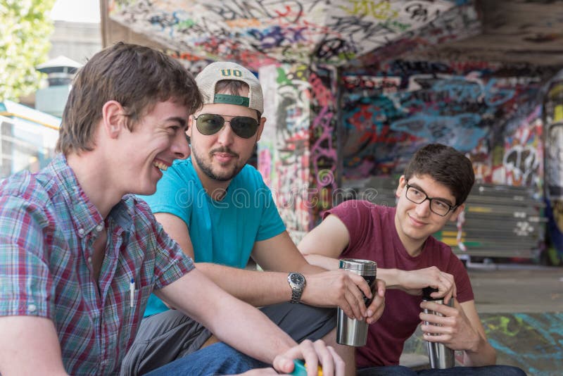 Three Guys Chatting Near Canal Stock Image - Image of caucasian, male ...