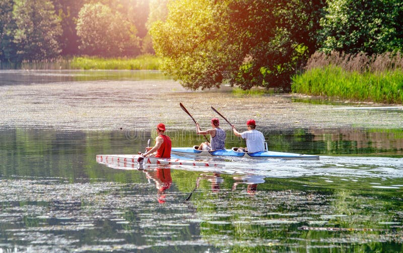Three Guys Floating in a Canoe Stock Image - Image of people, summer ...
