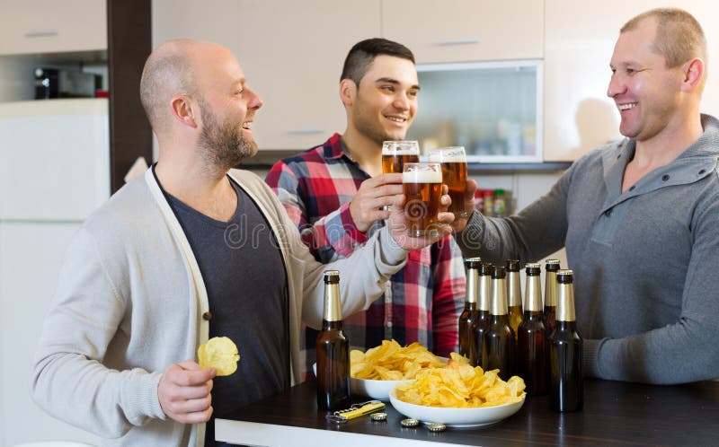 Three guys at house party stock photo. Image of caucasian - 50111240