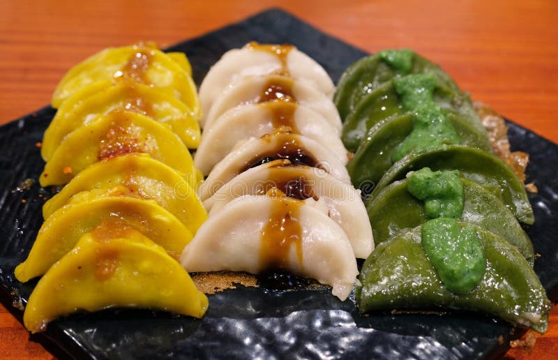 Three gyoza on black plate stock image. Image of closeup - 151713023