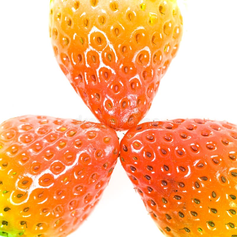 Three Half-ripe Strawberries with Leaves Stock Photo - Image of group ...