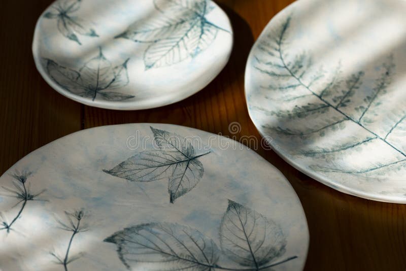 Three Handmade Light Blue Ceramic Plates with Decorative Leaf Prints ...