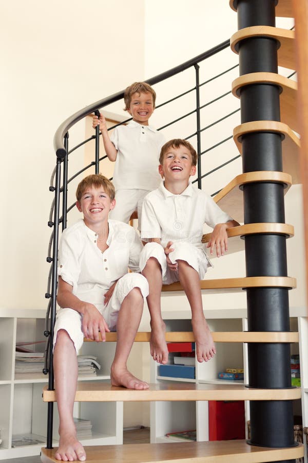 Three Happy Brother Sitting on Steps. Stock Photo - Image of portrait ...