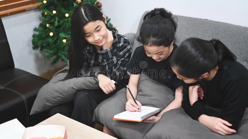 Three Children Studying Online Together at Home. Stock Photo - Image of ...