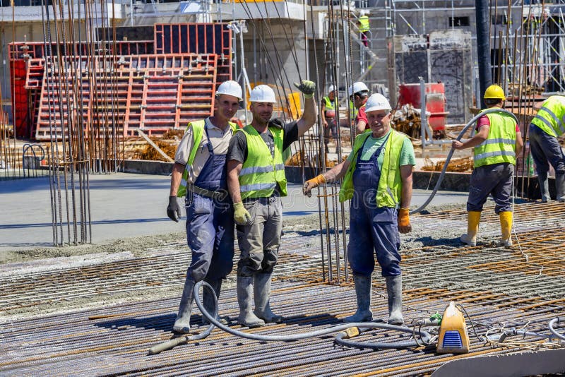 Three Happy Construction Workers Posing Editorial Image - Image of ...