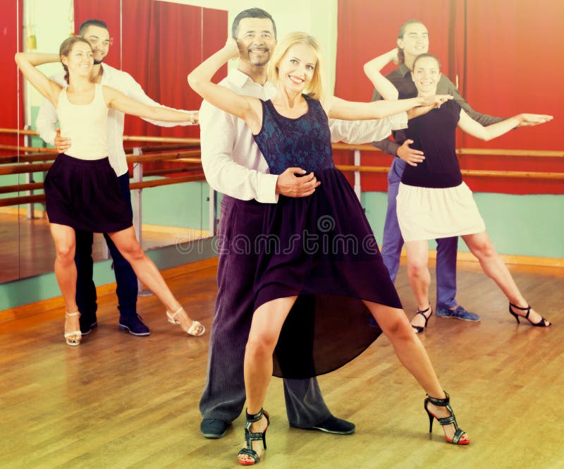 Three Happy Couples Dancing Tango Stock Photo - Image of entertainment ...