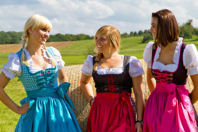 Two Charming Ladies in Traditional Dirndls Stock Photo - Image of ...
