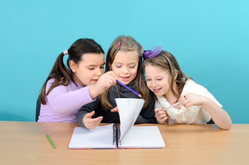 Three Happy Girls Doing Their School Work Stock Photo - Image of ...