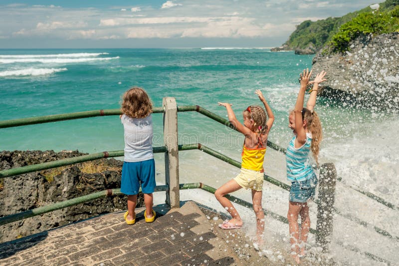 Three Happy Kids Playing on Beach Stock Photo - Image of leisure ...