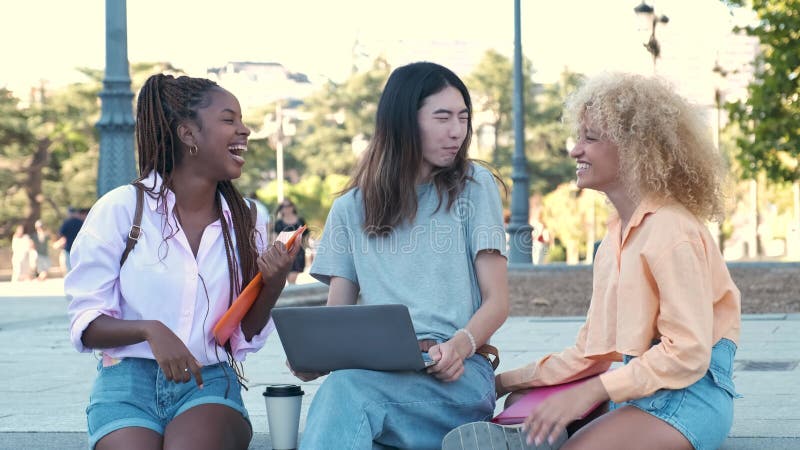 Three Happy Multiracial Friends High Five and Laughing at a Park. Stock ... Three Happy Multiracial Friends High Five and Laughing at a Park. Stock ...
