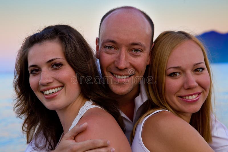 Three Happy People on the Beach Sunset Stock Image - Image of head ...