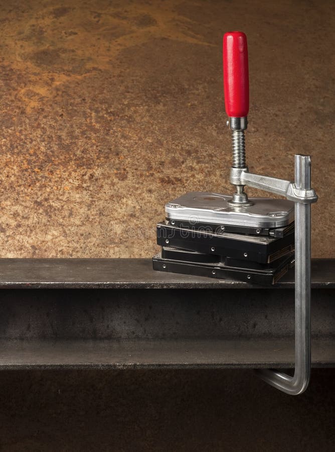 Three Hard Drives Pressed Together with a Clamp Stock Image - Image of ...