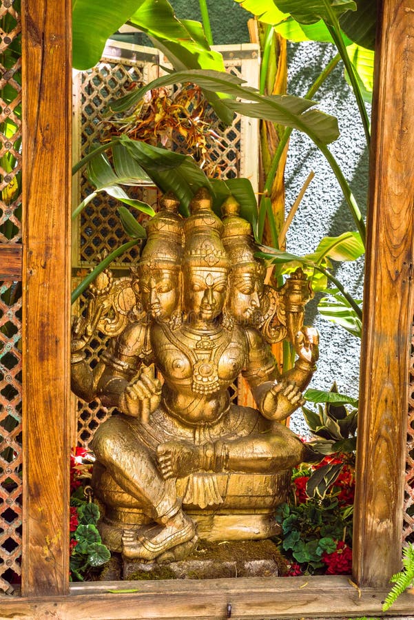 Three headed golden statue stock image. Image of hinduism - 43920003
