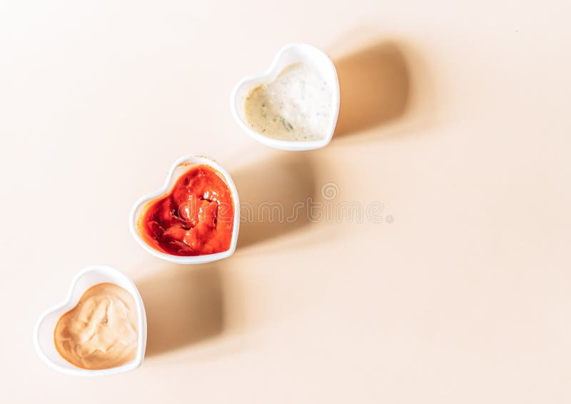 Three Heart-shaped Cups Filled with Different Sauces Stock Image ...