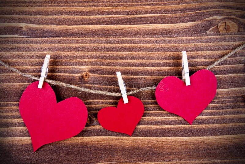 Three Hearts in Different Sizes on a Line Stock Image - Image of ...