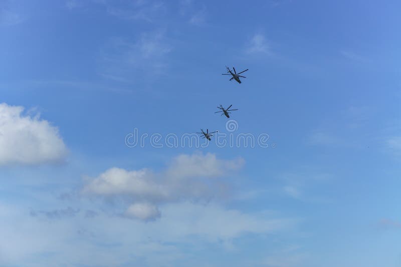 Three Helicopters in the Sky, Military Helicopters in a Cloudless Sky ...