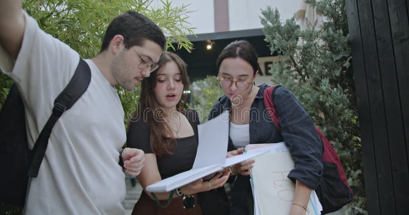 High School Students Collaborating on Homework: Three Teenagers Working ...
