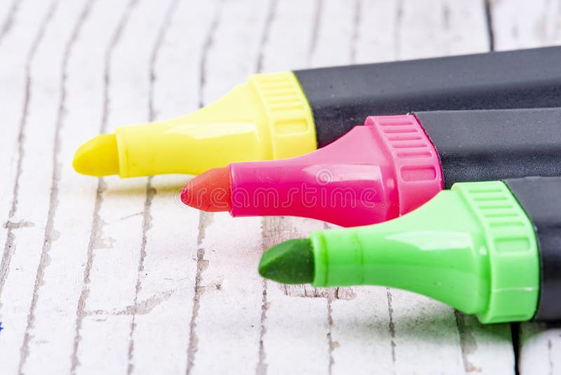 Three Highlighters in Yellow Pink and Green on Rustic White Wood Stock ...