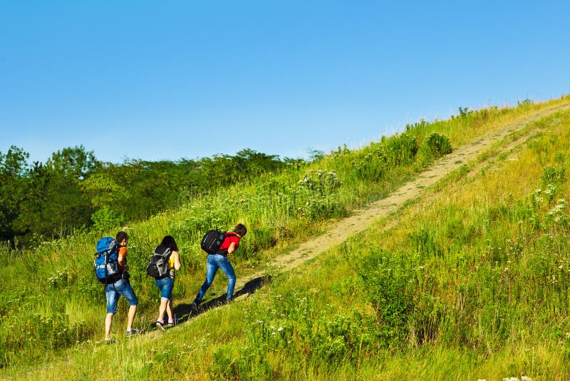 Three hikers stock photo. Image of journey, student, backpack - 27961540