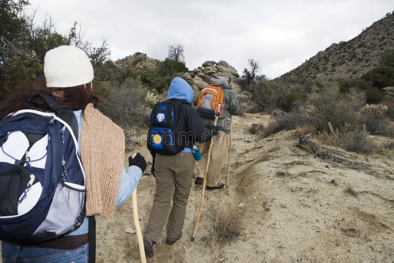 Three Hikers Joined by Safety Line in Snowy Mountains Mid Section on ...