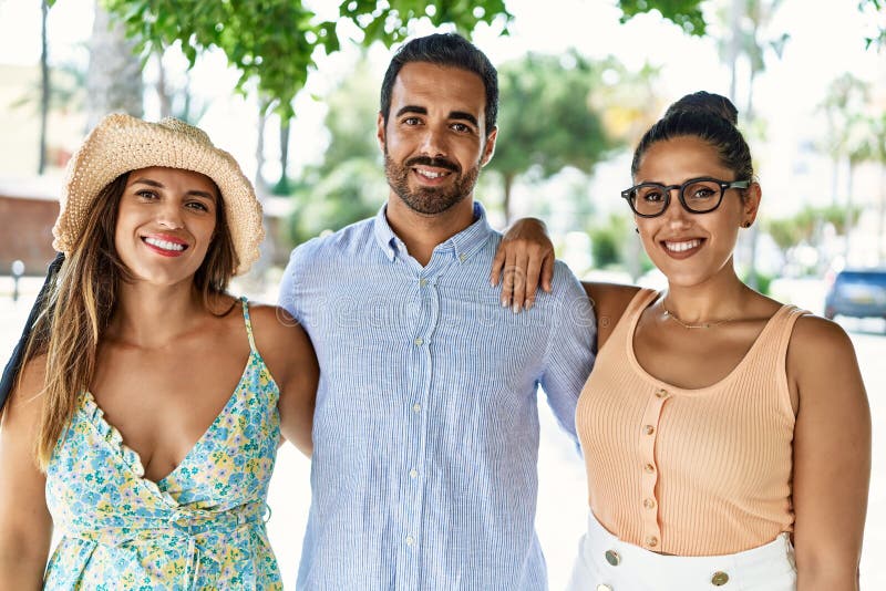 Three Hispanic Friends Smiling Happy Standing at the City Stock Image ...