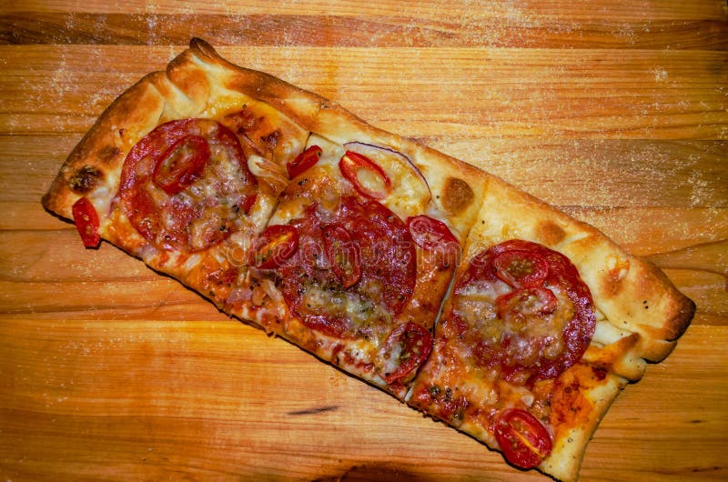 Three Home Made Pizza Slices on a Wooden Cutting Board Stock Photo - Image of salami, slices ...