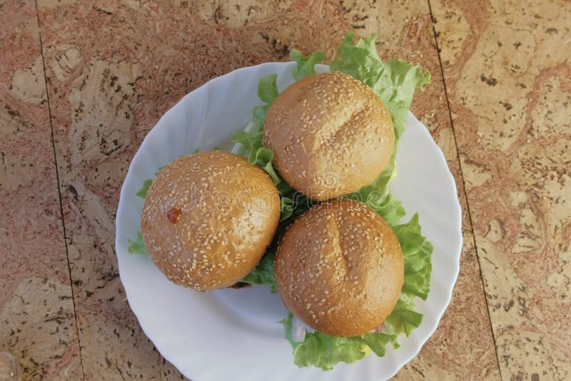 Three Homemade Burgers on the White Plate. Top View. Stock Image ...