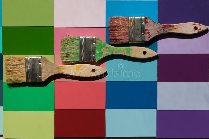 Horizontal Paint Brushes on Brightly Colored Tiles Stock Photo - Image ...