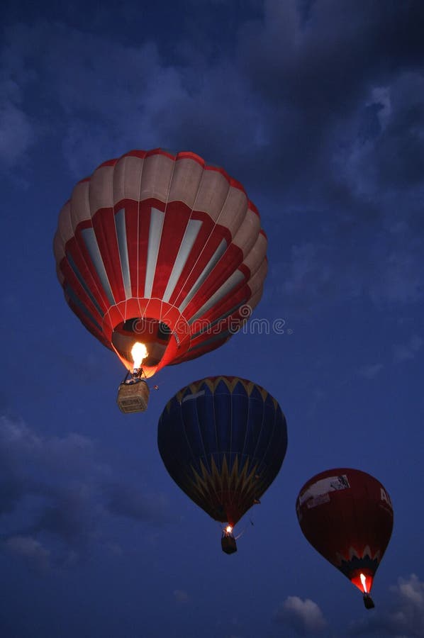 Three Hot Air Balloons Flying by Night Stock Image - Image of night ...