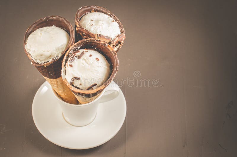 Three Ice Cream with Cone in Chocolate on a in a White Cup/three Ice ...
