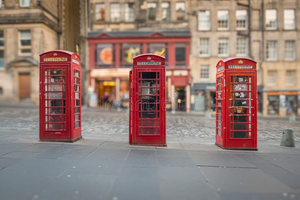 Three Iconic Red Phone Boxes in the Street Stock Image - Image of ...