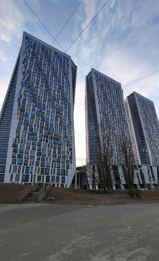 Three Identical Skyscrapers of a Futuristic Shape are Built in a Row ...