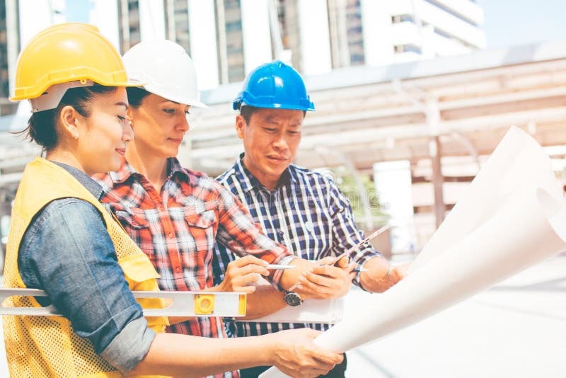 Three Industrial Engineer Wear Safety Helmet Engineering Working and ...