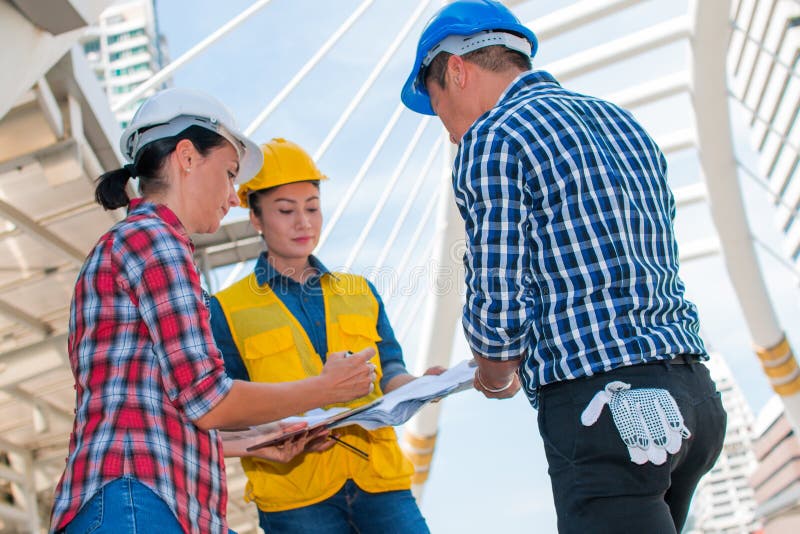 Three Industrial Engineer Wear Safety Helmet Engineering Working and ...
