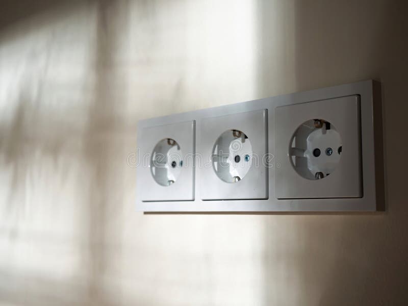 Three Installed Wall Sockets on Light Wall Stock Photo - Image of ...