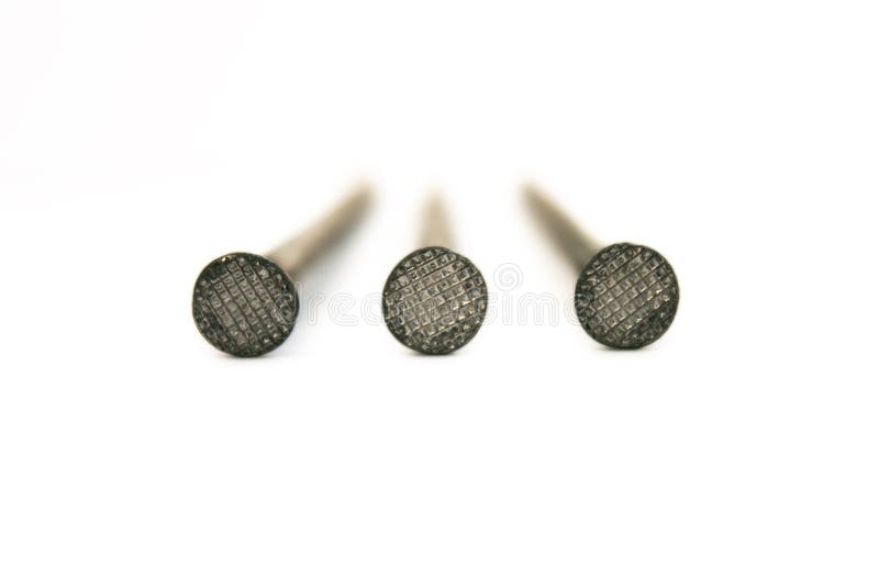 Three iron nails stock image. Image of steel, pattern - 23954995