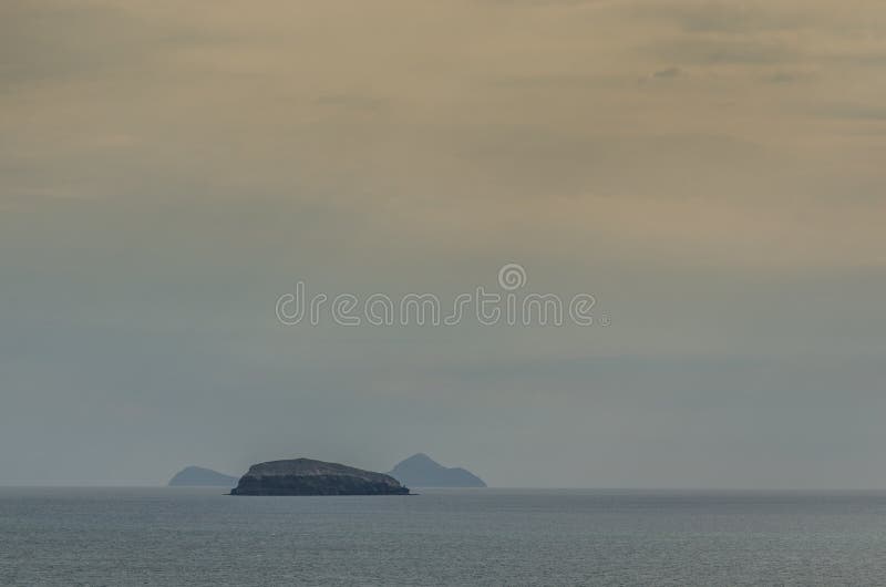 Three islands at sunset stock image. Image of dawn, purely - 107614375