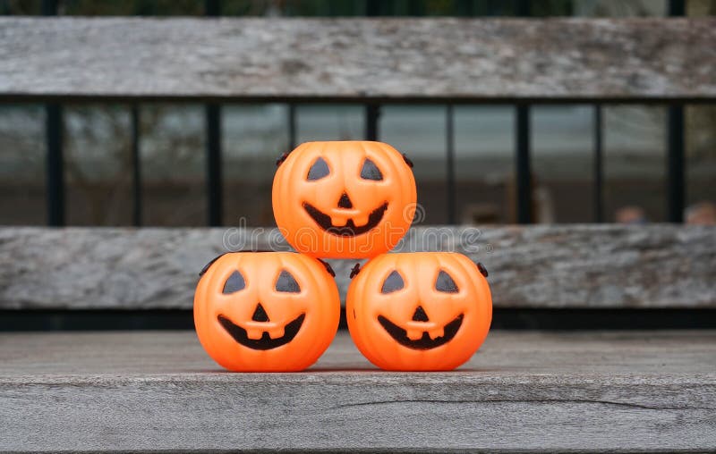 Three Jack-O-Lantern Stack on Wooden Bench Stock Photo - Image of bench ...