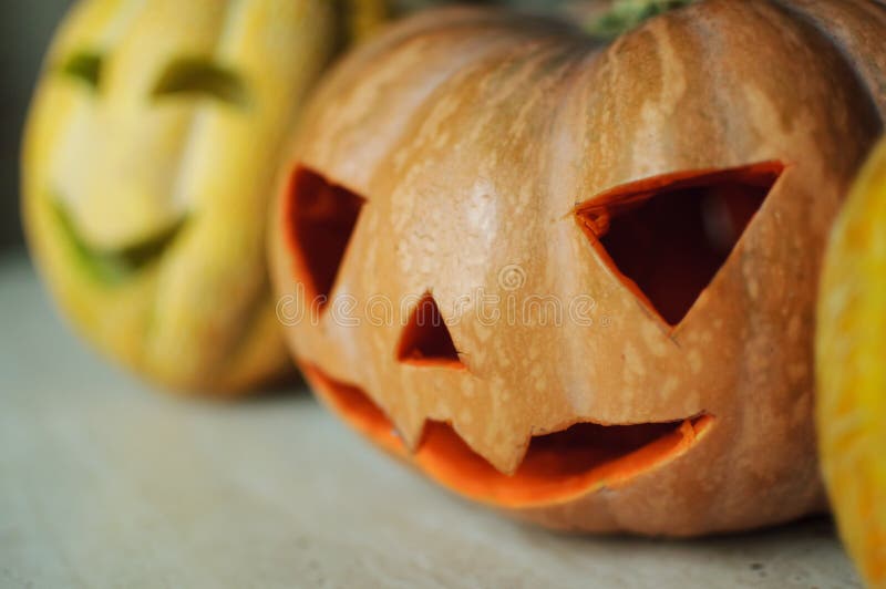 Three Jack-o`-lanterns from Pumpkin and Melons on Kitchen Table. Stock ...