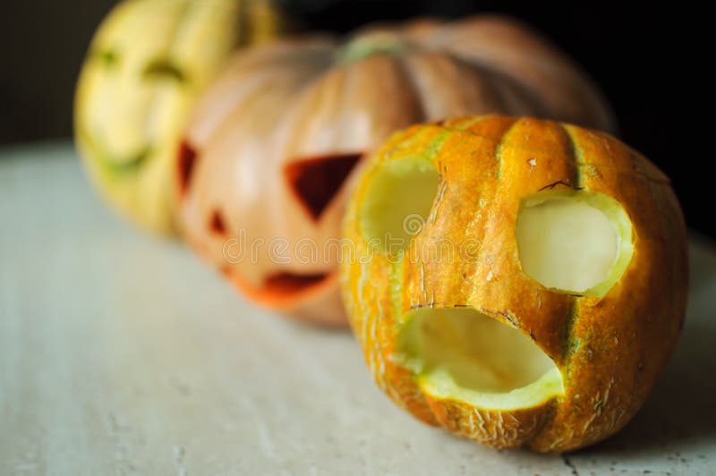 Three Jack-o`-lanterns from Pumpkin and Melons on Kitchen Table. Stock ...