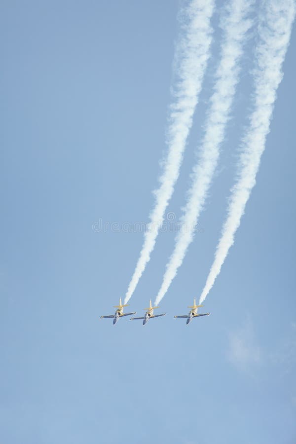 Three Jet Airplanes Performing Aerobatic Stunt Stock Photo - Image of ...